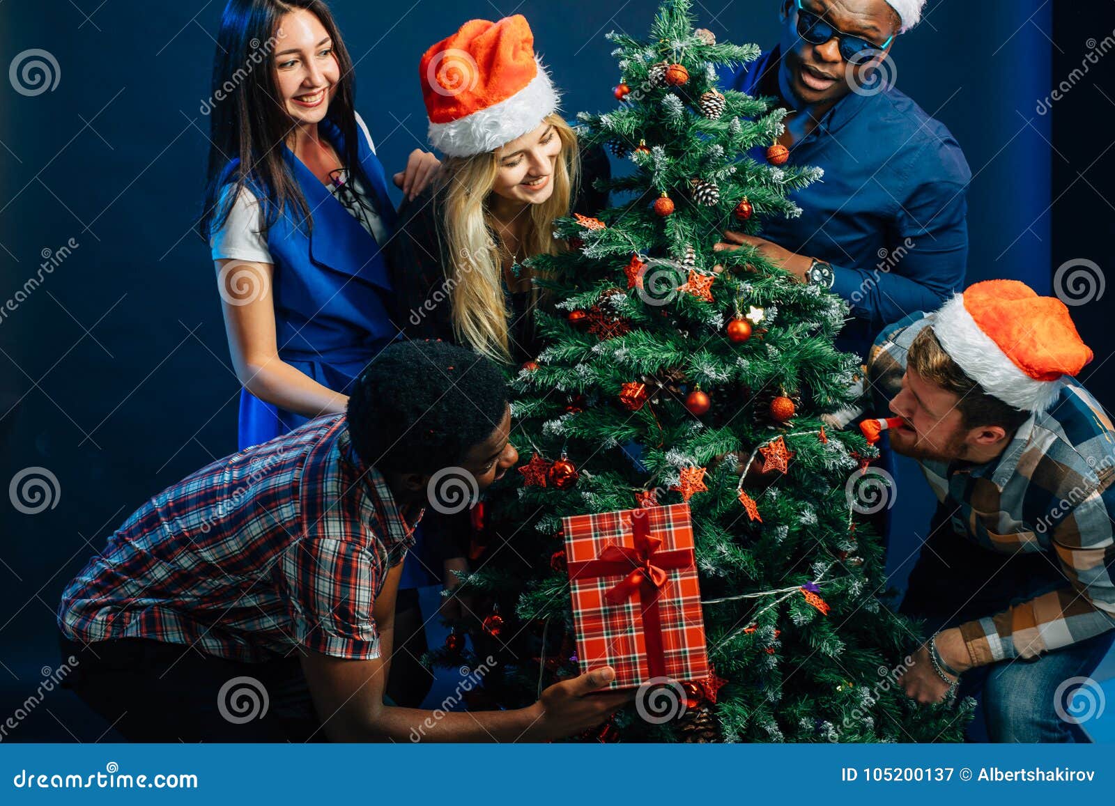 Friends Makes Fun on Christmas Holyday with Christmas Tree Stock Image ...