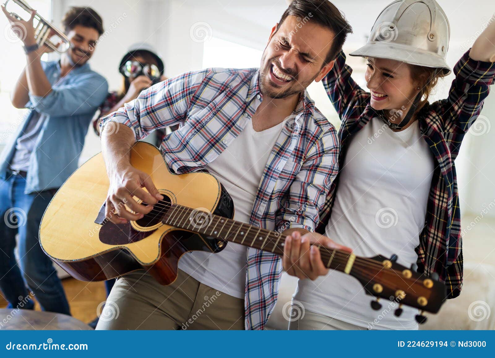 Cheerful Friends Playing on Music Instruments and Having Fun at Home ...