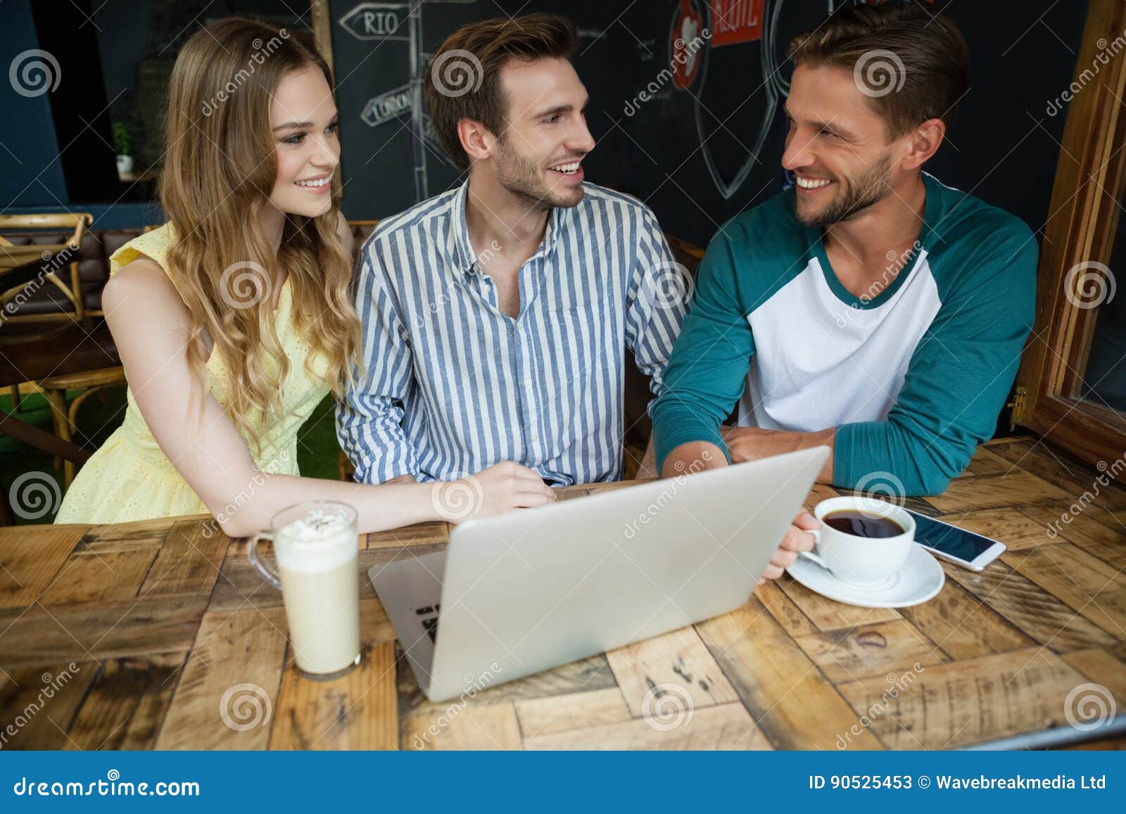 Cheerful Friends Sitting by Table Stock Image - Image of holding, hair ...
