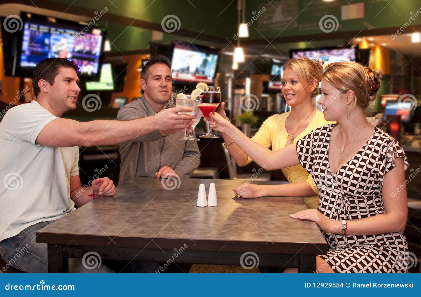 Cheerful friends toasting stock photo. Image of dinner - 12929554