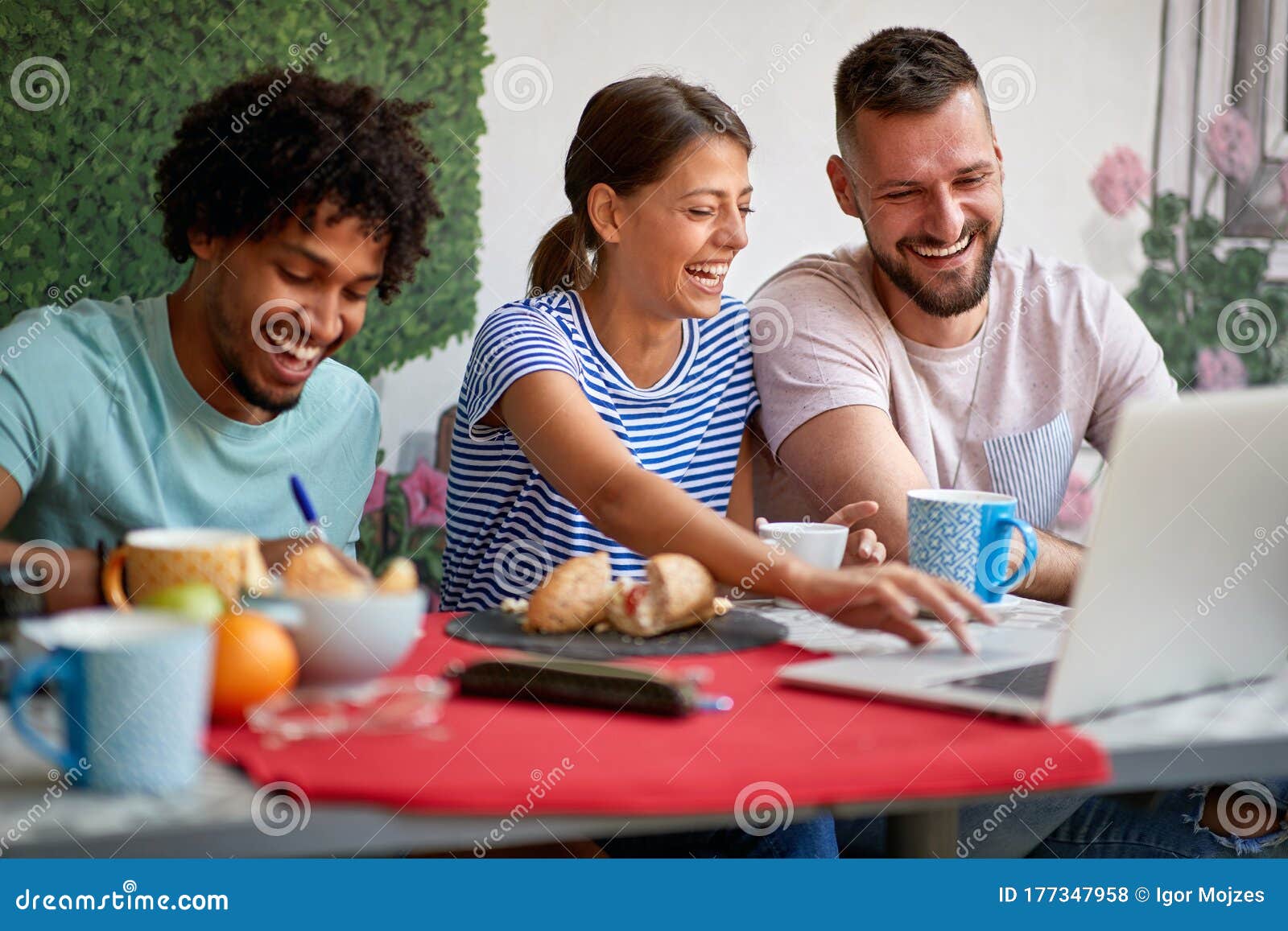 Cheerful Friends Working Together on Laptop Stock Photo - Image of ...