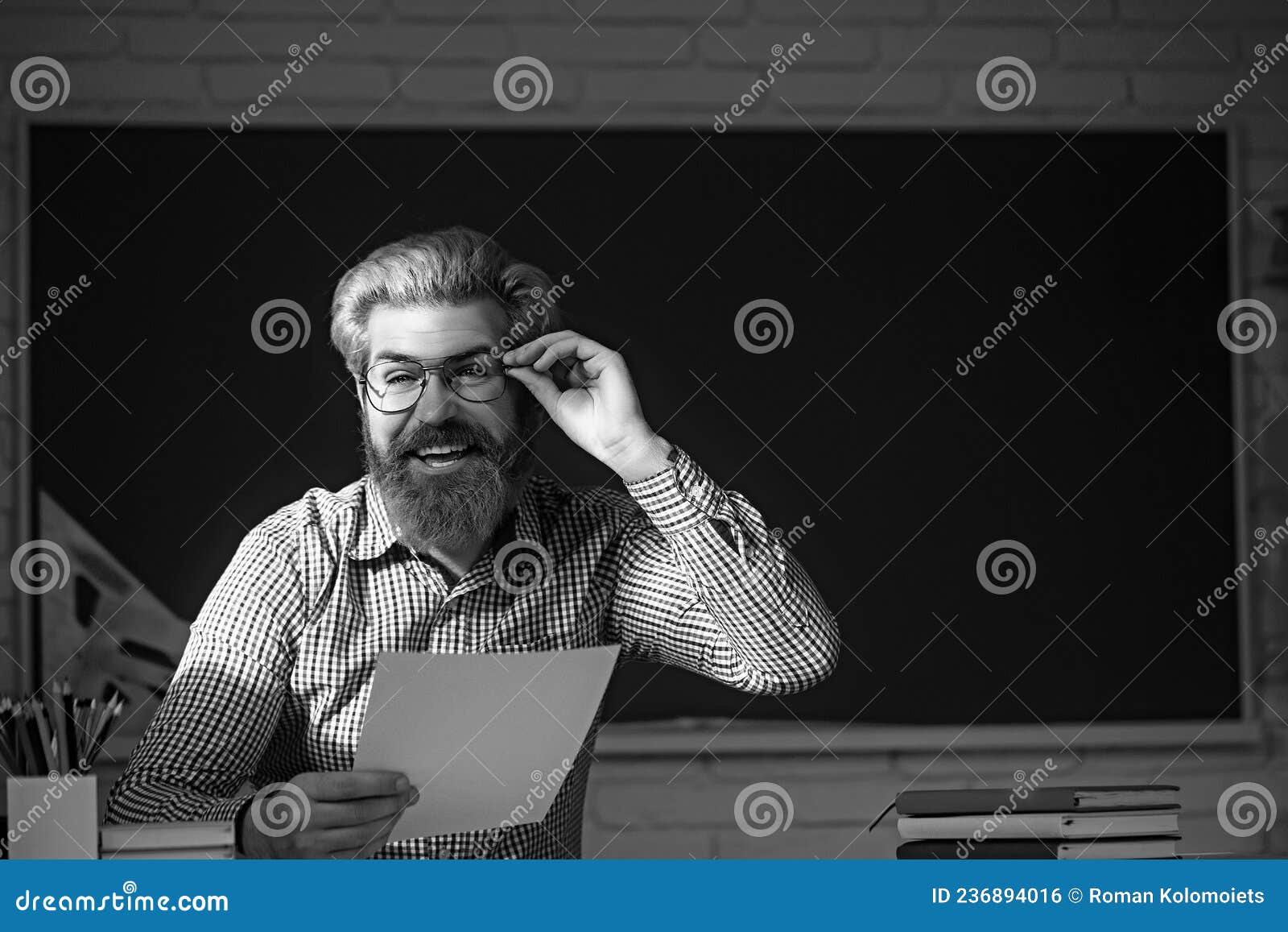 Cheerful Funny Academic Professor Smiling and Holding Glasses. Stock ...