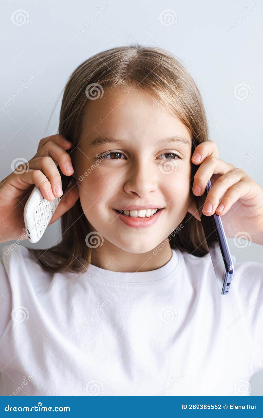 Cheerful Girl Talking on White Push-button Phone and Smartphone ...
