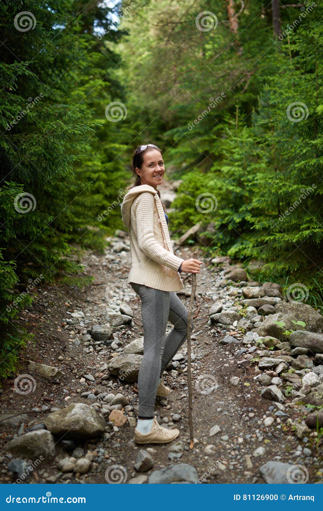 Cheerful Girl Walking through Forest Path, Looking Back Smiling Stock ...