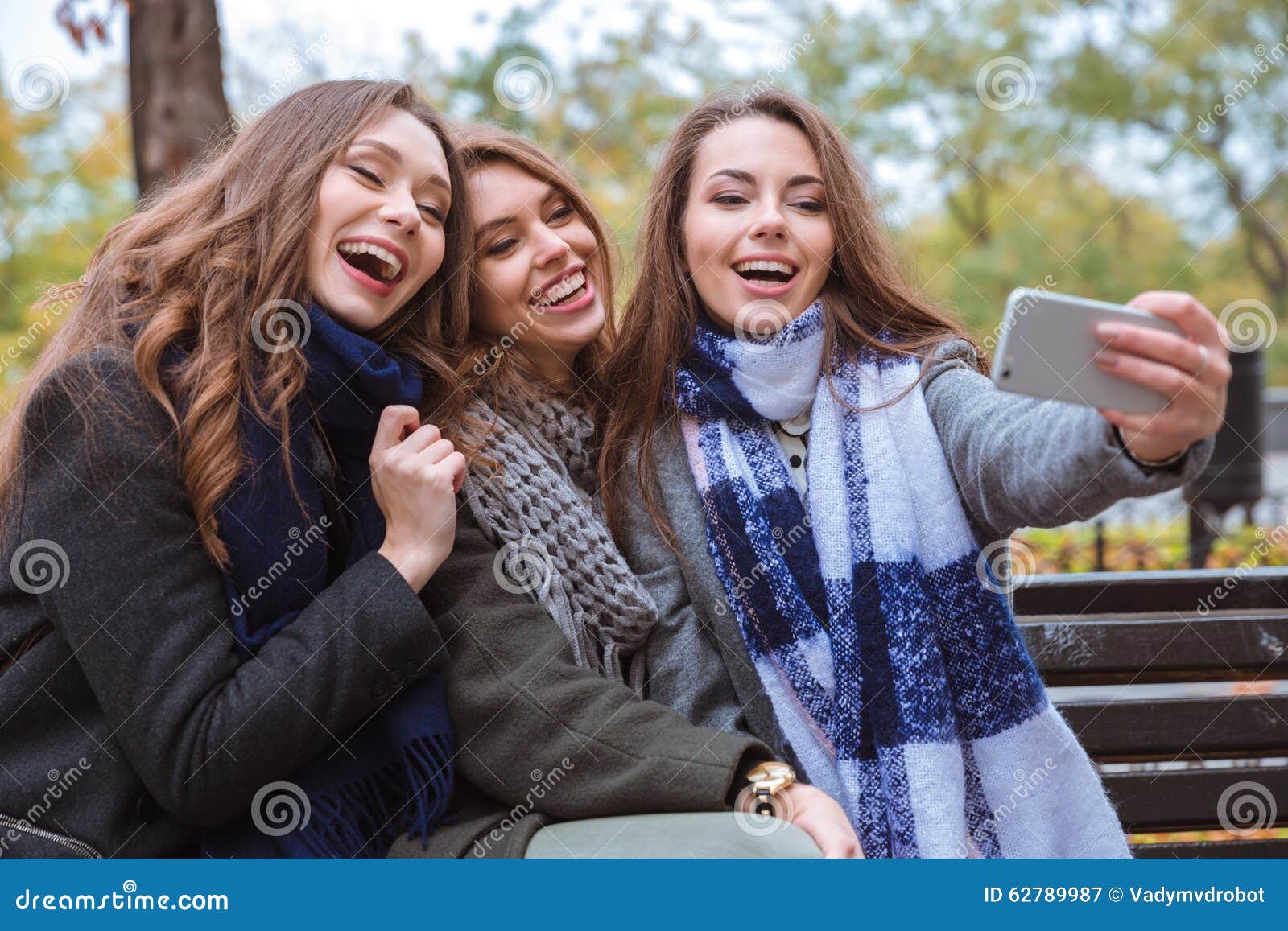 Cheerful Girlfriends Making Selfie Photo On Smartphone Stock Image