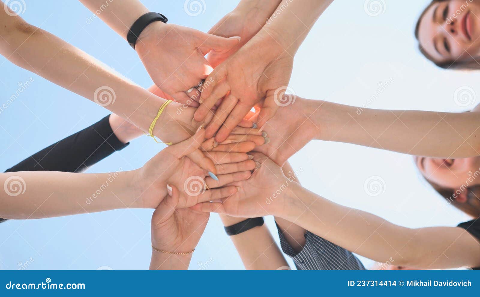 Cheerful Girls Join Hands Together As a Sign of Unity and Joint ...