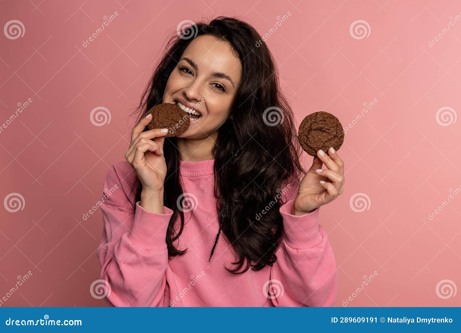 Cheerful Good Looking Young Brunette Eating Her Favorite Oatmeal