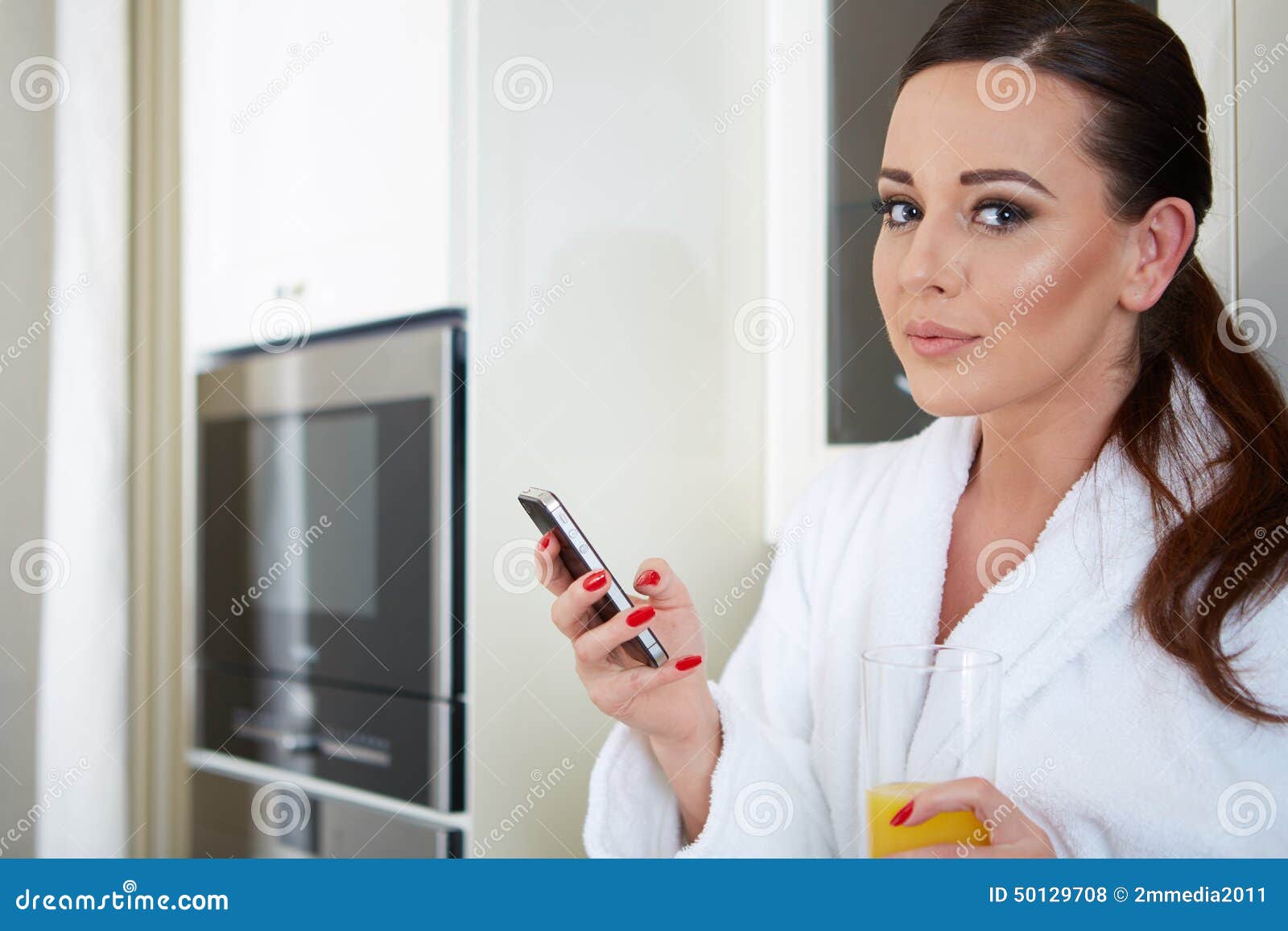 Cheerful Gorgeous Model Holding Smartphone Stock Photo - Image of ...