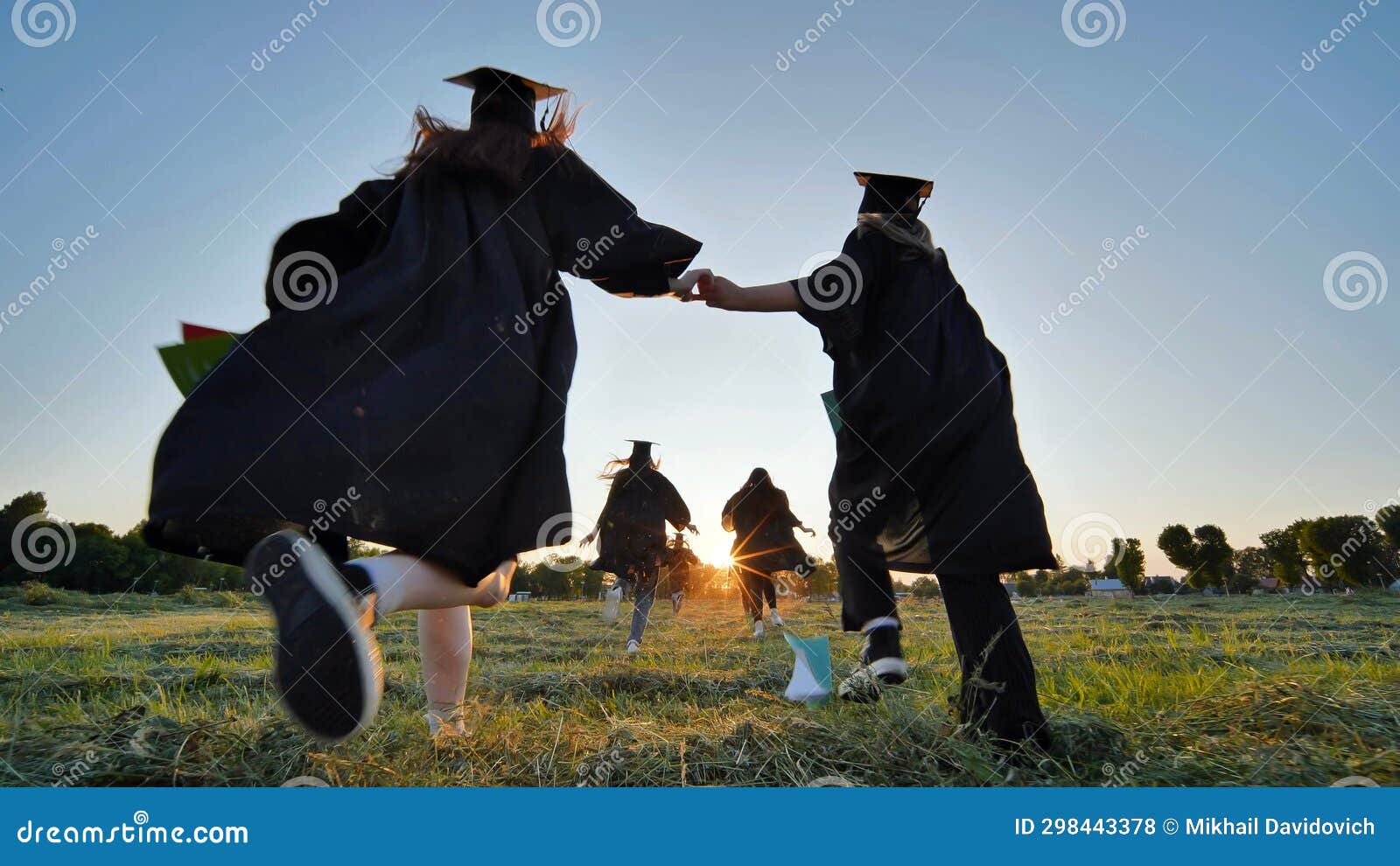 Cheerful Graduates Students Run after School at Sunset. Stock Photo ...