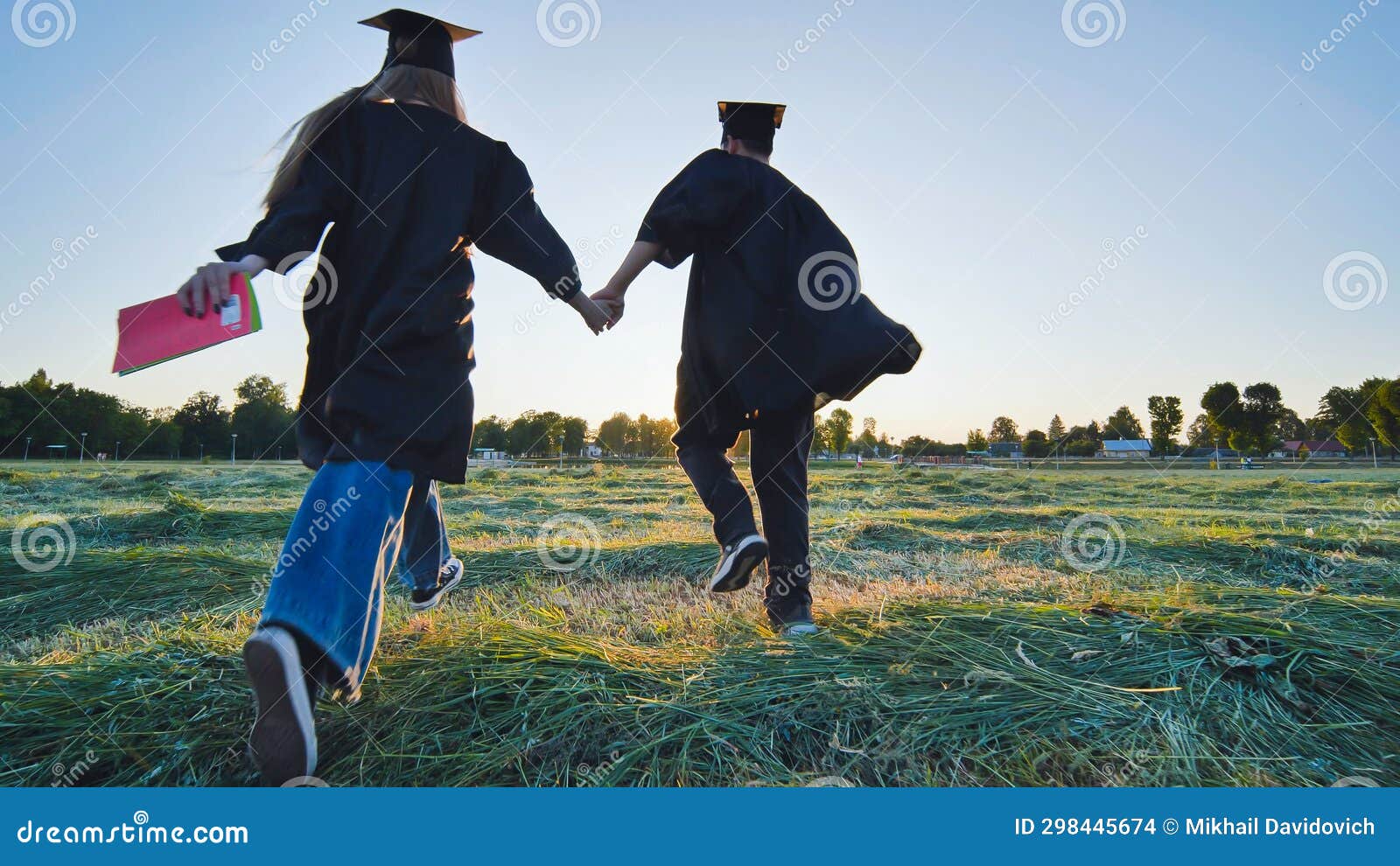 Cheerful Graduates Students Run after School at Sunset. Stock Photo ...