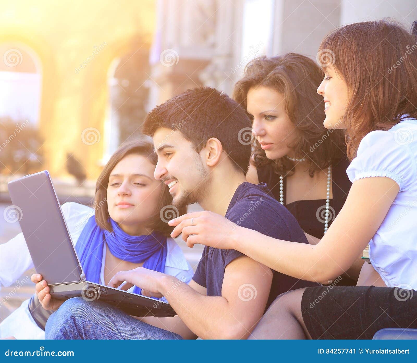 Cheerful Group of Students Smiling and Looking at a Laptop. Stock Image ...