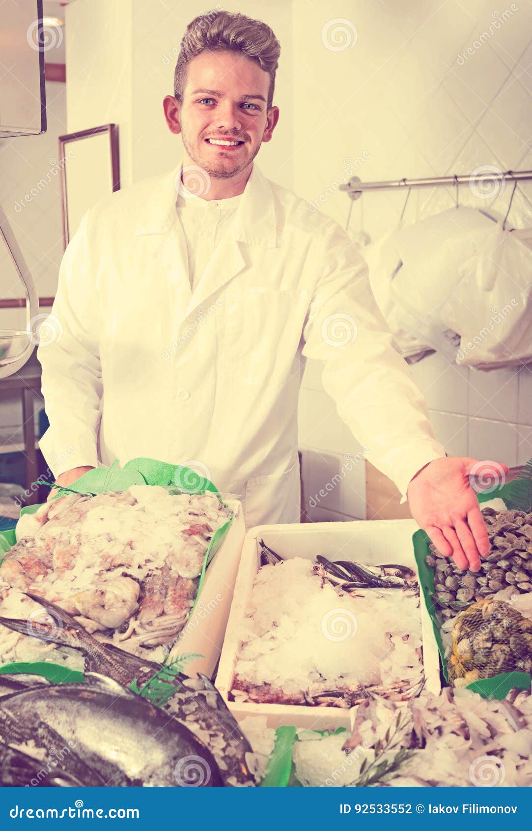 Cheerful Guy Selling Chilled Fish and Seafood Stock Photo - Image of ...