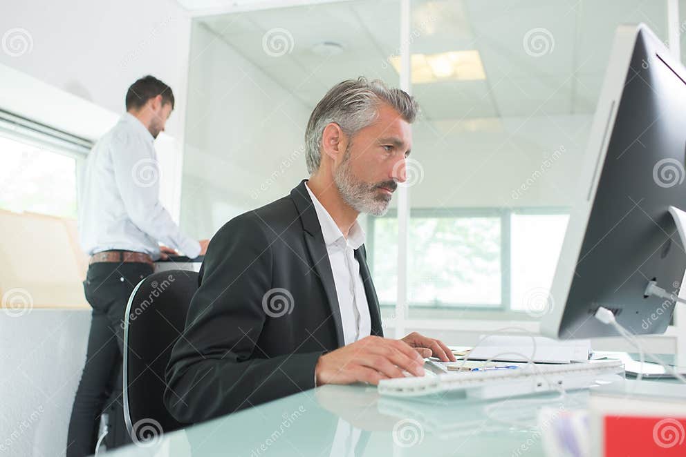Cheerful Guy Sitting in Front Desktop Computer Stock Image - Image of ...