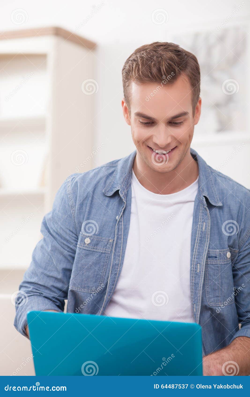Cheerful Guy is Using a Notebook at Home Stock Image - Image of ...