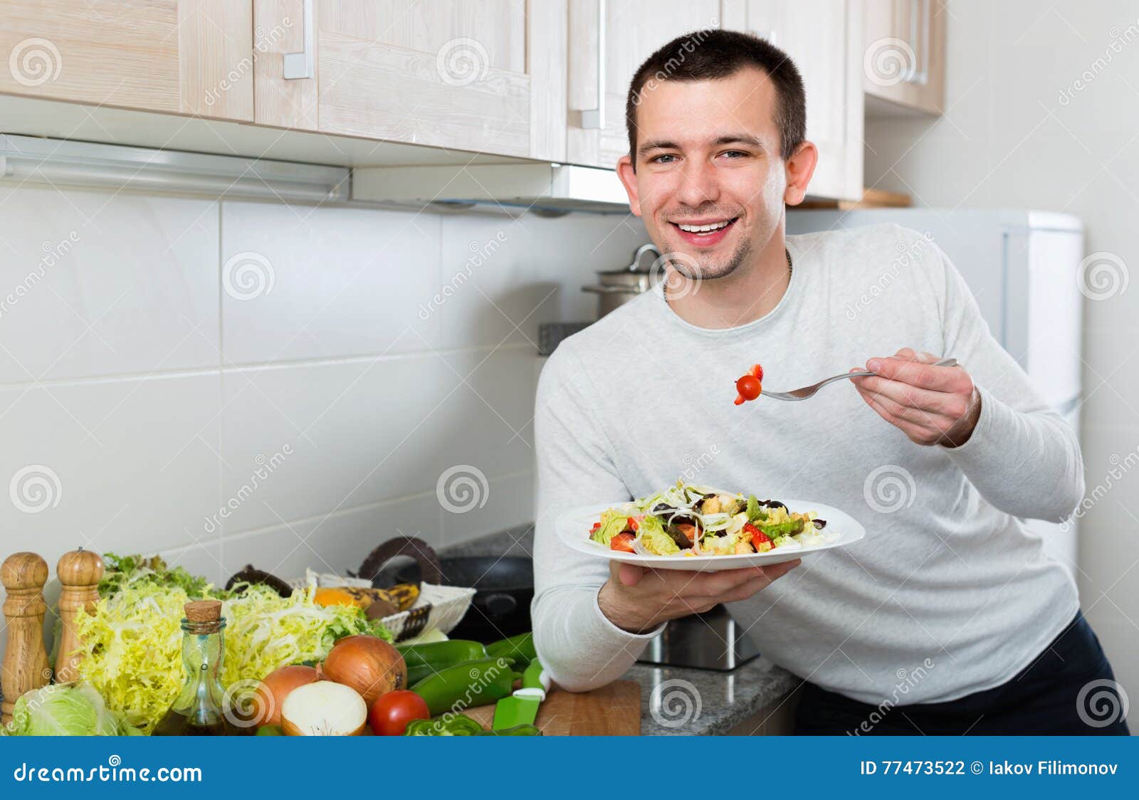 Cheerful Handsome Man Holding Plate with Salad Stock Photo - Image of ...