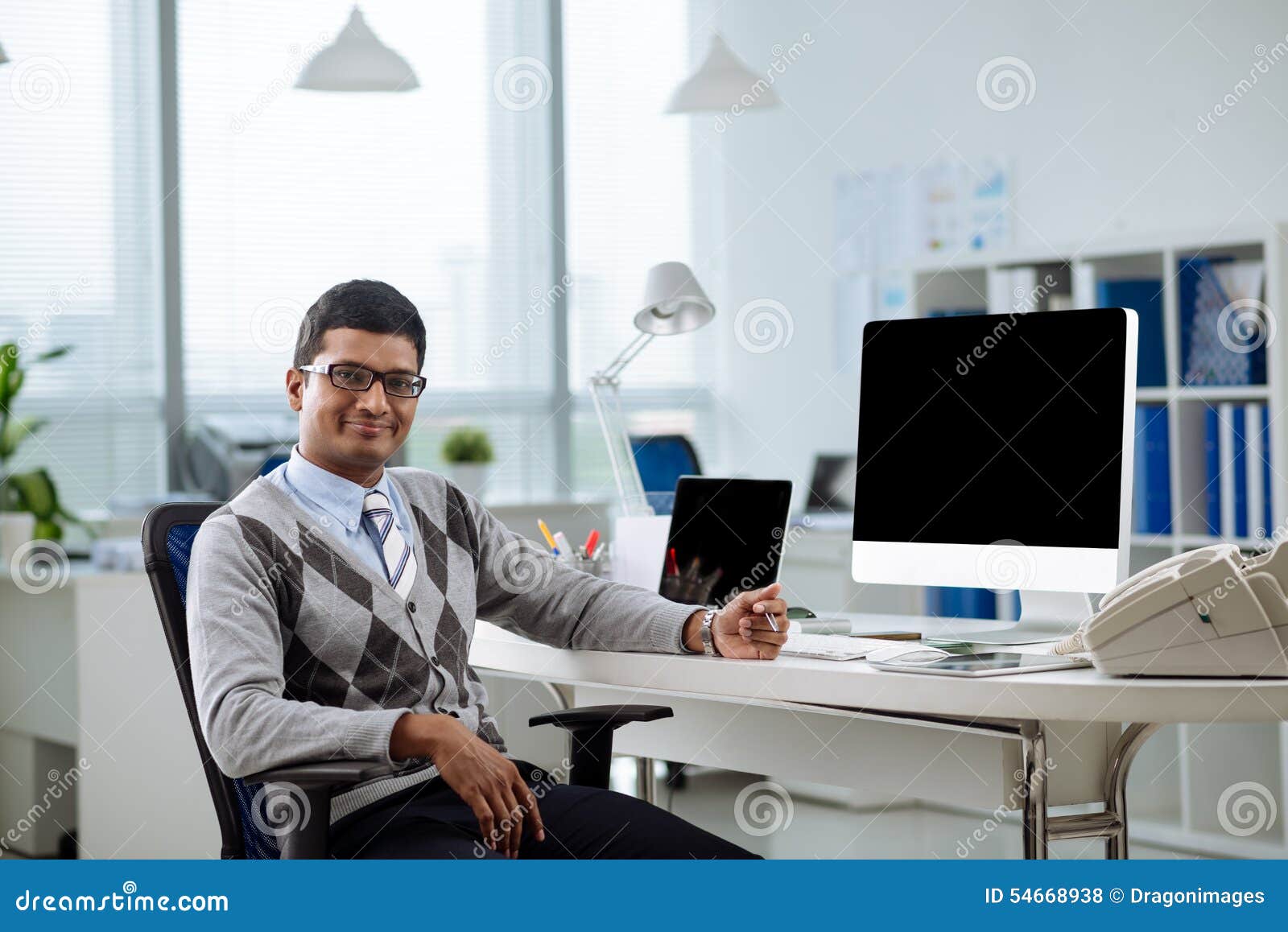 Cheerful Indian manager stock photo. Image of writing - 54668938