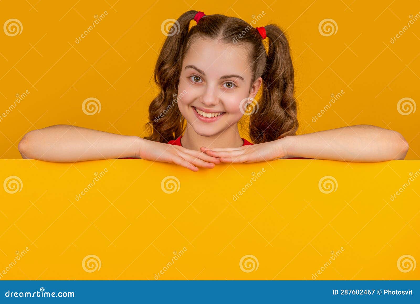 Cheerful Kid Behind Blank Yellow Paper with Copy Space for ...