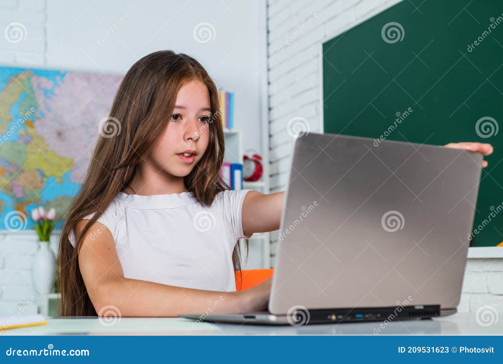 Cheerful Kid Girl with Computer at School Lesson, E Learning Stock ...