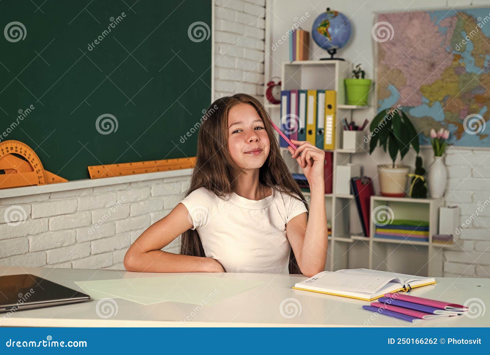 Cheerful Kid Girl Making Notes at School Lesson, Knowledge Stock Photo ...