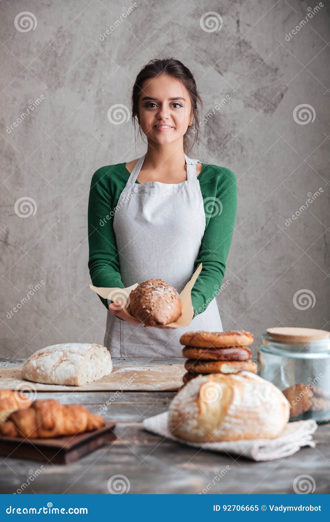 Cheerful Lady Baker Standing and Holding Bread Stock Image - Image of ...