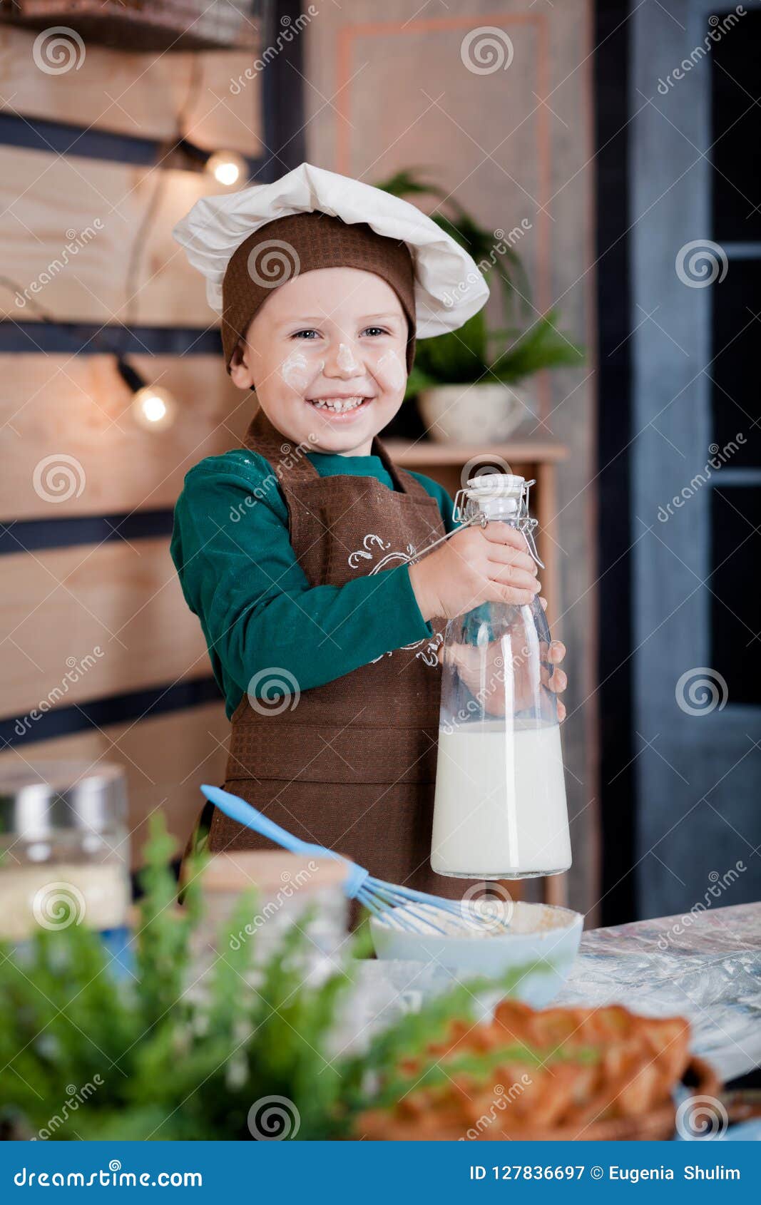Cheerful Little Boy is Baking Buns. Little Baker. French Buns. F Stock ... Cheerful Little Boy is Baking Buns. Little Baker. French Buns. F Stock ...