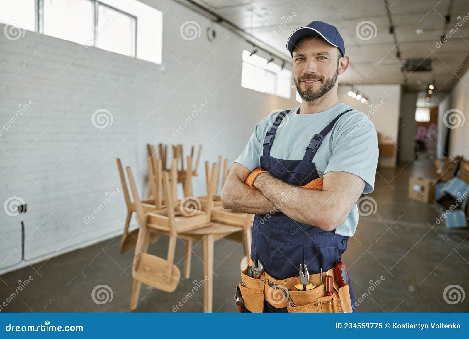 Cheerful Male Worker in Cap Standing in Workshop Stock Image - Image of ...