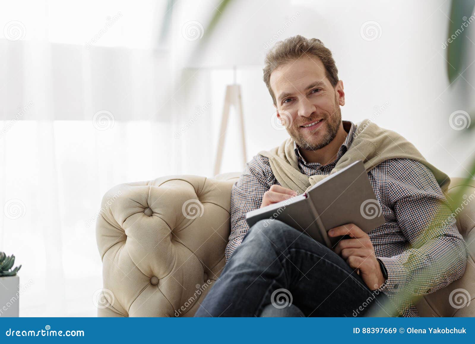 Cheerful Man Making Notes into Notebook Stock Image - Image of house ...