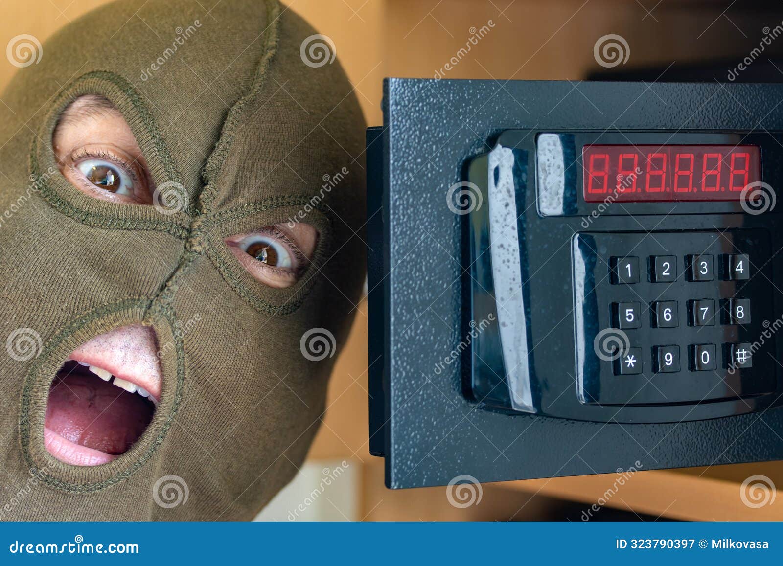 A Cheerful Man in a Mask Celebrates Success by Opening a Safe Stock ...