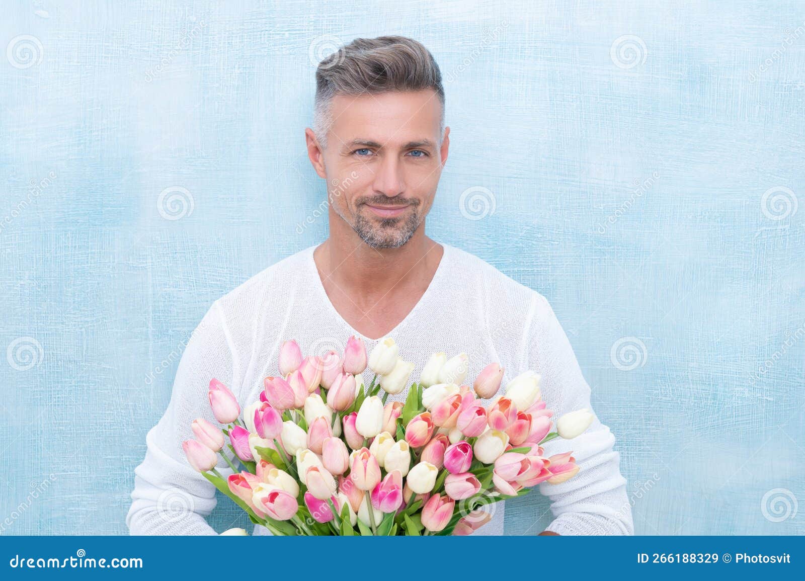 Cheerful Man with Spring Tulips in Studio. Man with Spring Tulips ...