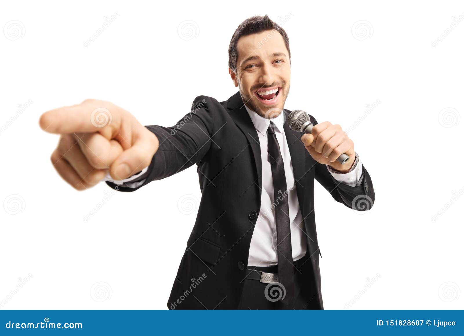 Cheerful Man in a Suit Pointing Towards the Camera and Holding a ... Cheerful Man in a Suit Pointing Towards the Camera and Holding a ...