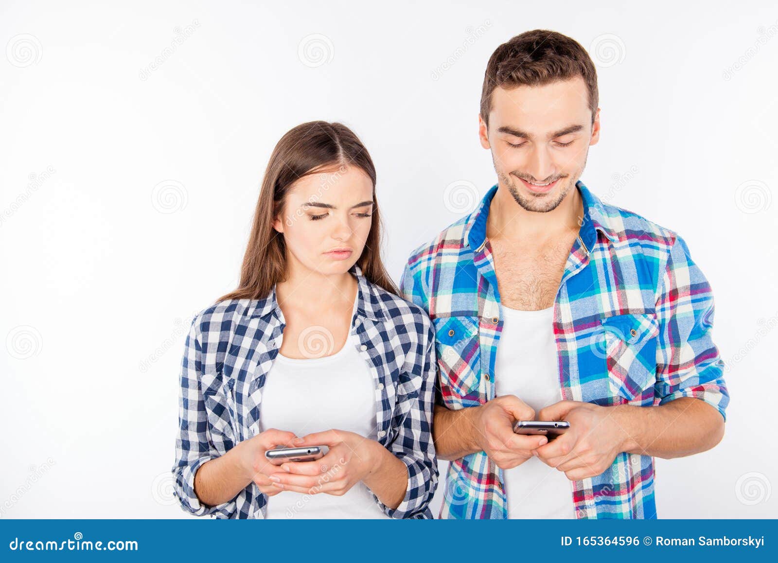 Cheerful Man Typing Message Ignoring His Girlfriend Stock Photo - Image ...