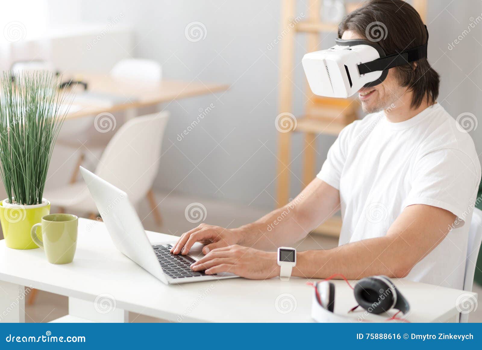Cheerful man using laptop stock photo. Image of life - 75888616