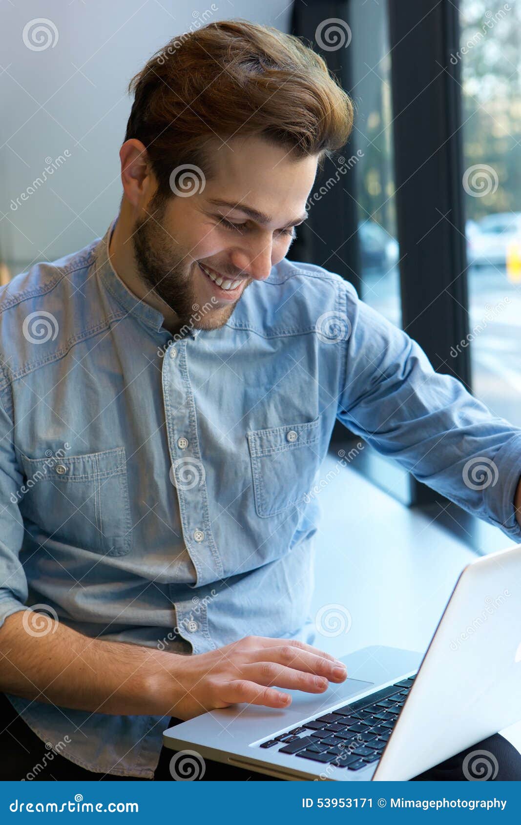 Cheerful man using laptop stock image. Image of cheerful - 53953171