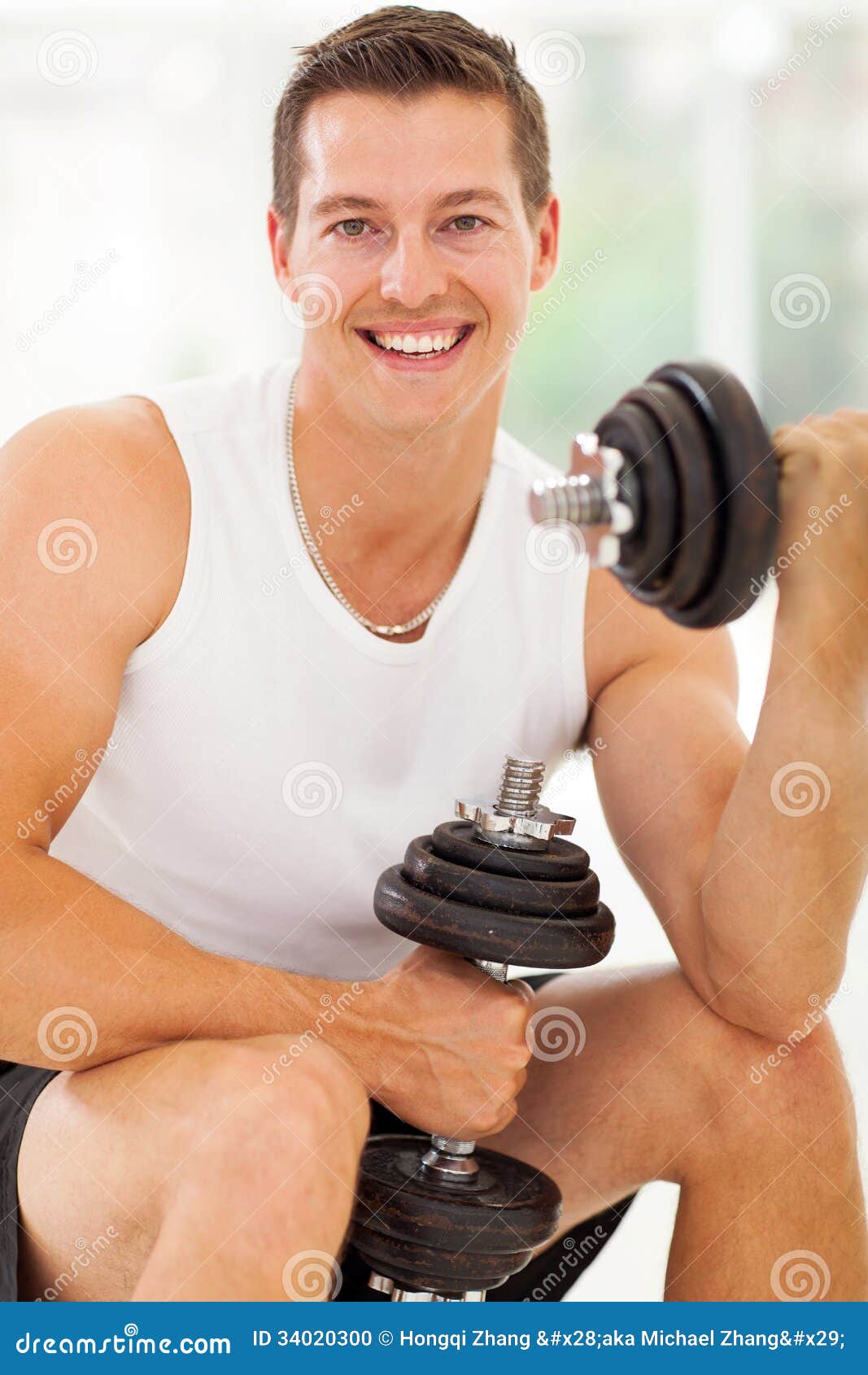 Cheerful man working out stock photo. Image of attractive - 34020300