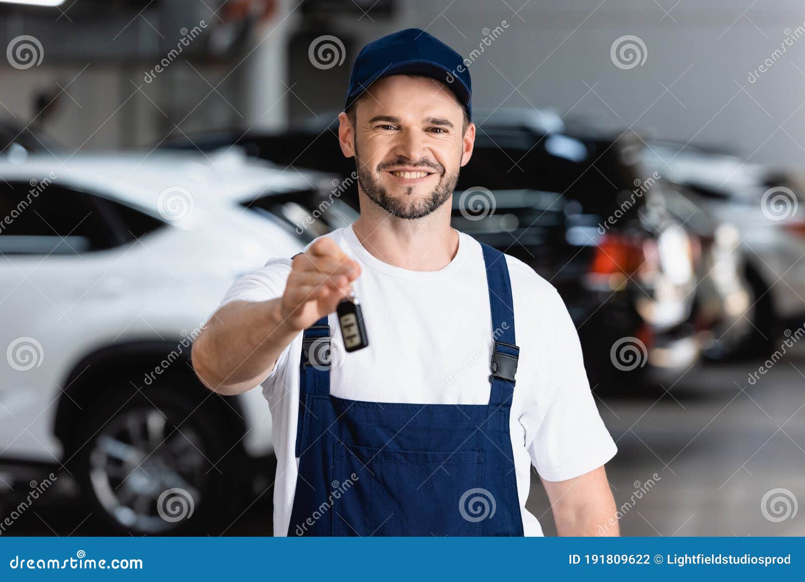 Cheerful Mechanic in Uniform and Cap Stock Photo - Image of repair ...