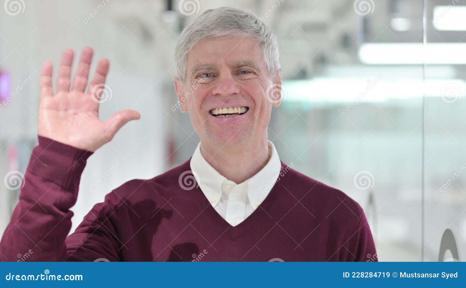 Cheerful Middle Aged Businessman Waving at the Camera Stock Image ...
