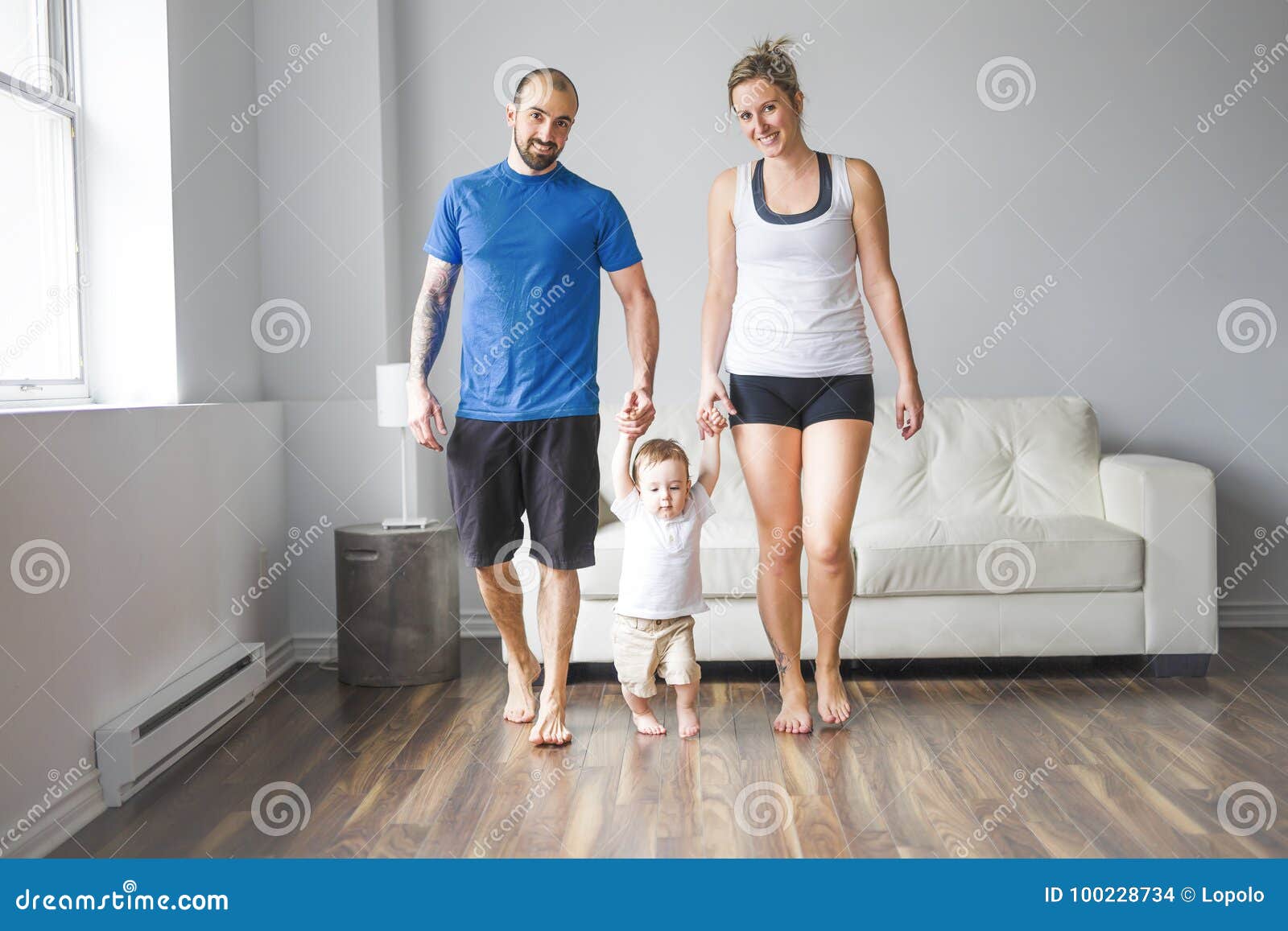 Cheerful Mom and Dad Help Their Son To Walk at Home Stock Photo - Image ... Cheerful Mom and Dad Help Their Son To Walk at Home Stock Photo - Image ...