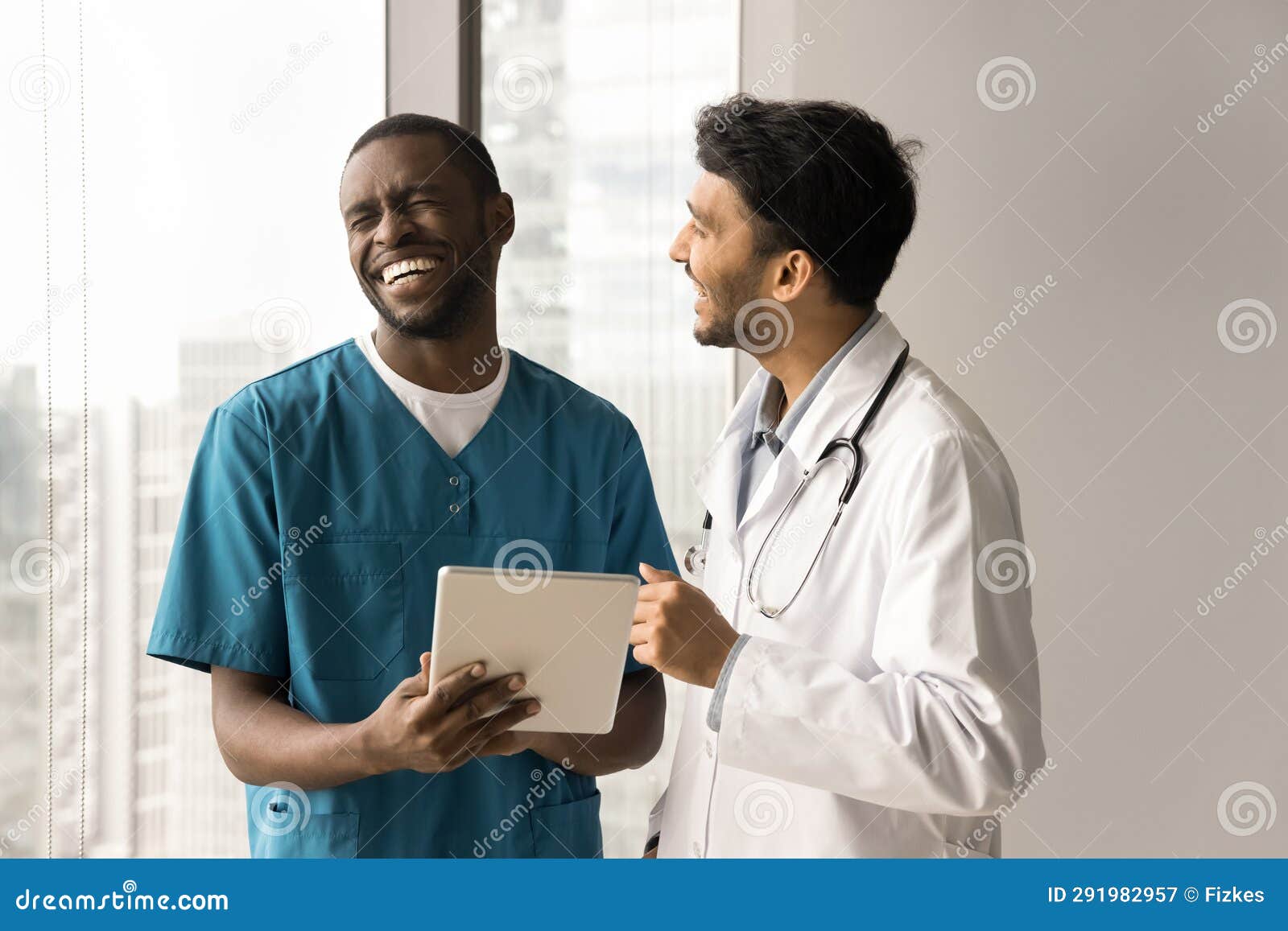 Cheerful Multiethnic Medical Doctor Colleagues Enjoying Friendship ...