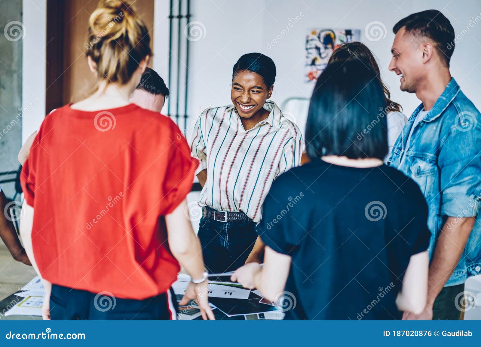 Cheerful Multiracial People Discussing Working Process in Room Stock ...