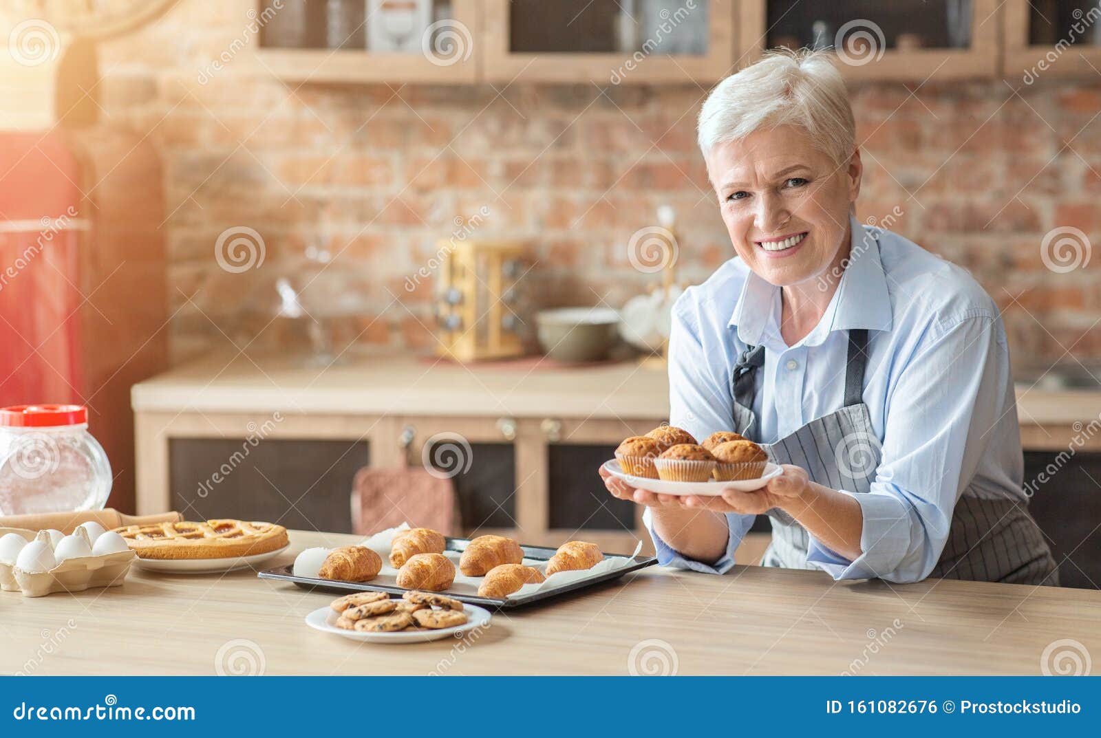 Cheerful Old Lady Posing with Freshly Baked Pastry in Kitchen Stock ...