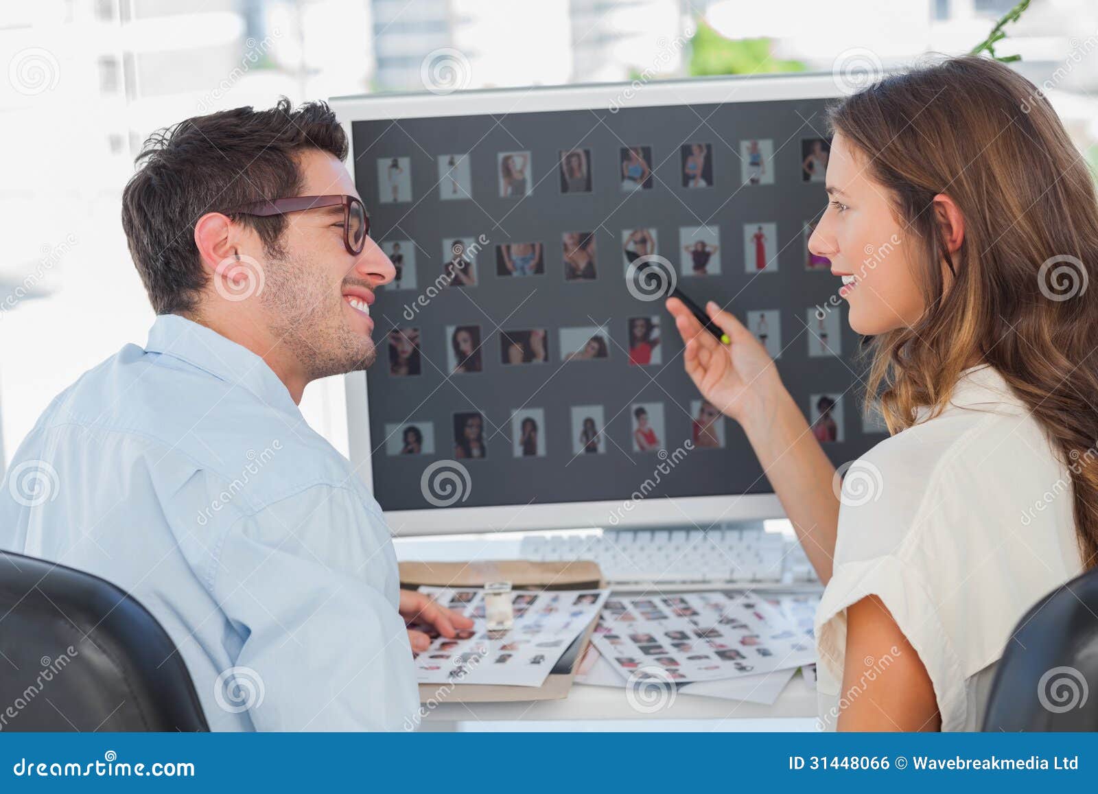 Cheerful Photo Editors Working on Thumbnails Stock Photo - Image of ...
