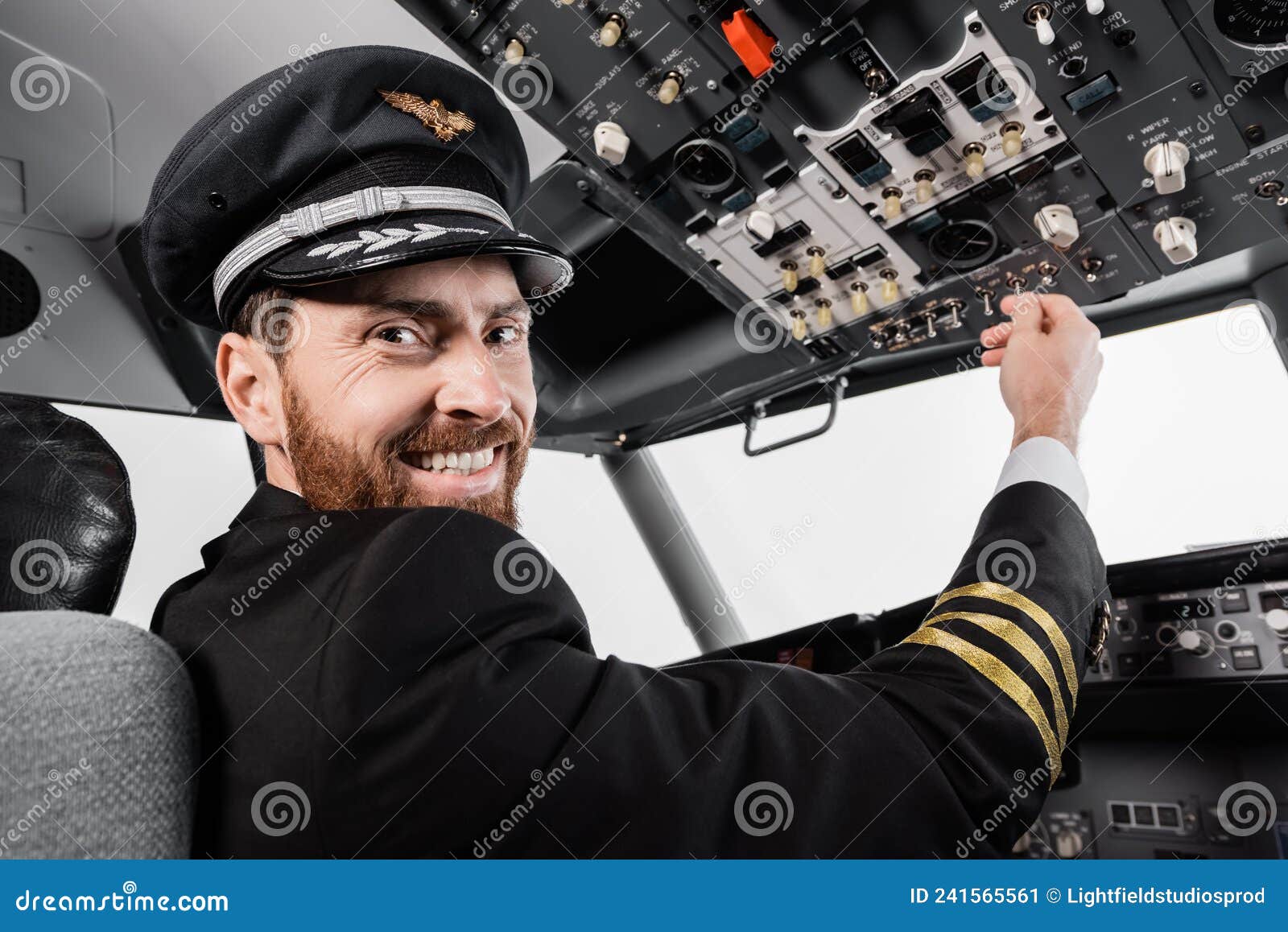 Cheerful Pilot in Cap Reaching Overhead Stock Image - Image of work ...
