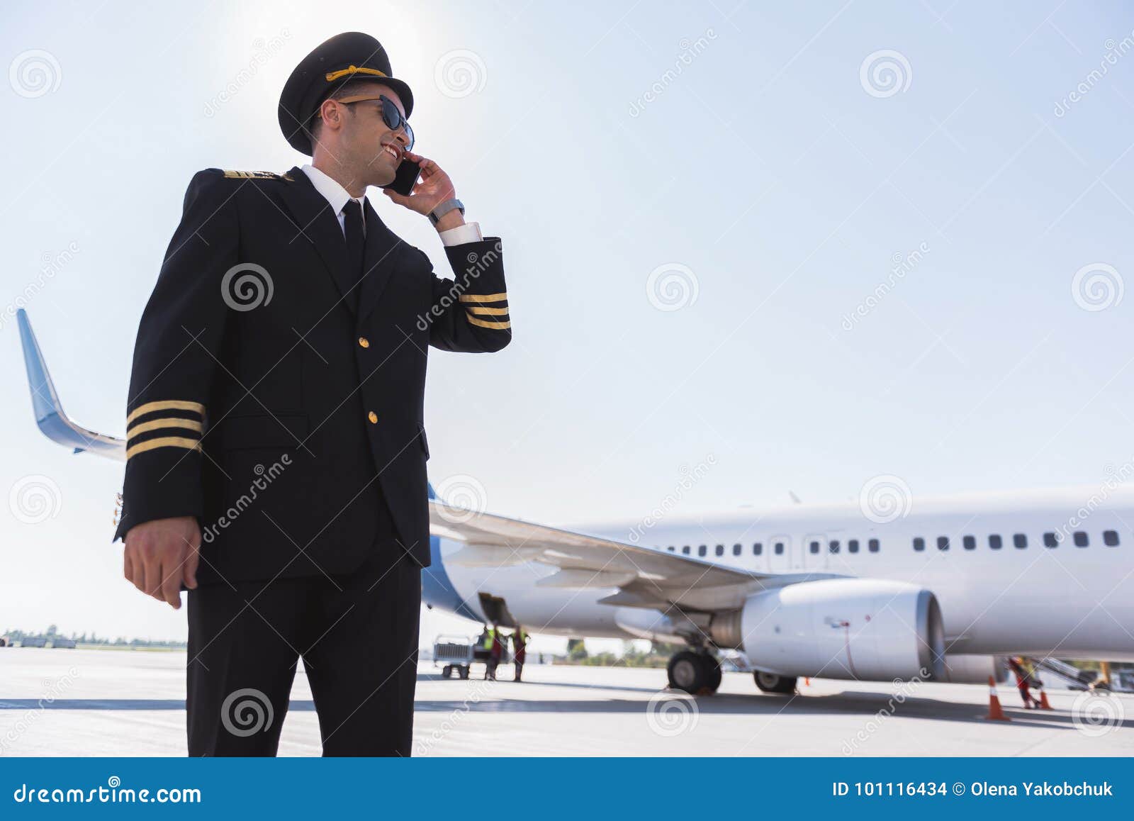 Hilarious Smiling Aviator Using Phone Outside Stock Photo - Image of ...