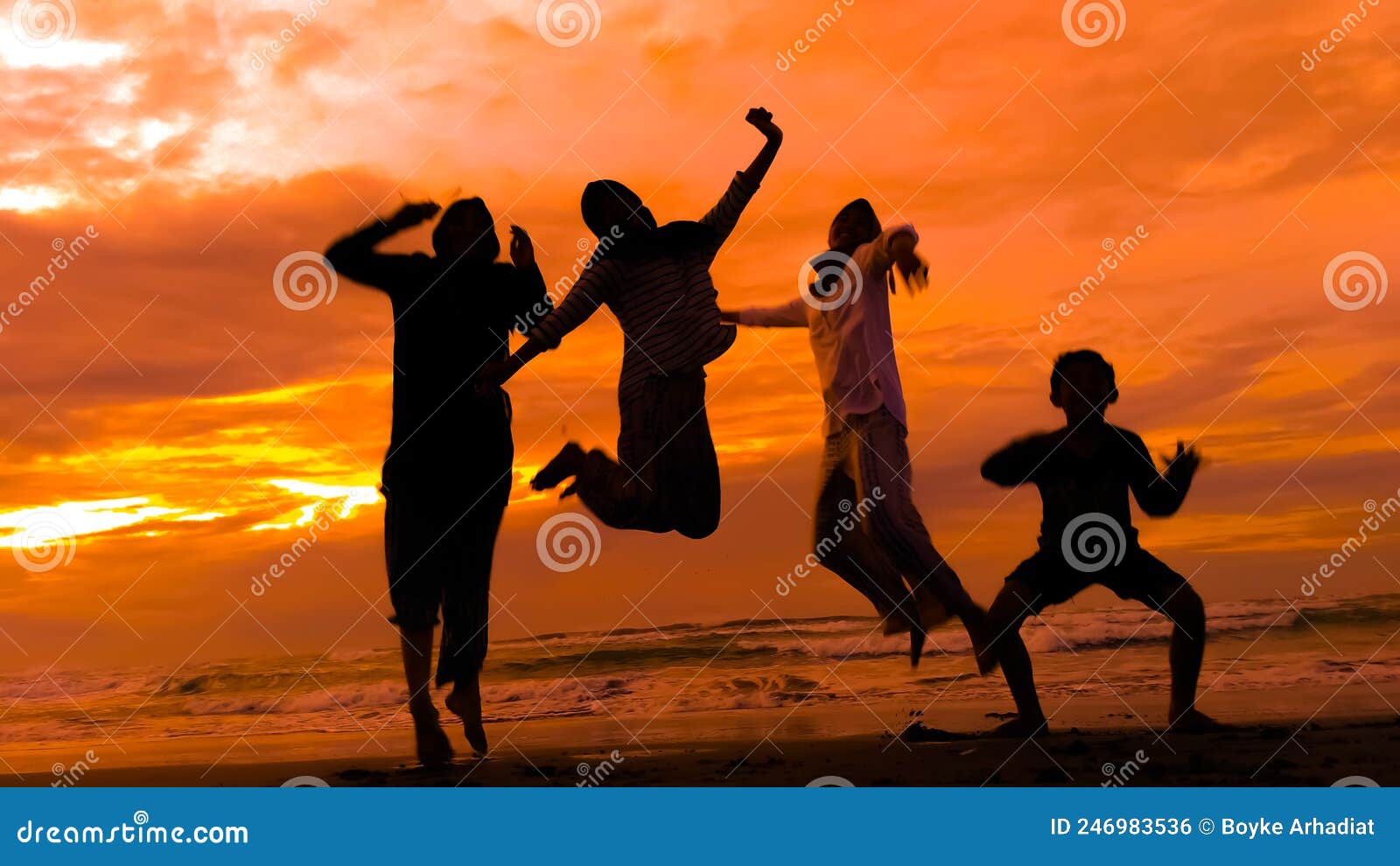 Cheerful Playing on the Beach Stock Photo - Image of dusk, sunset ...