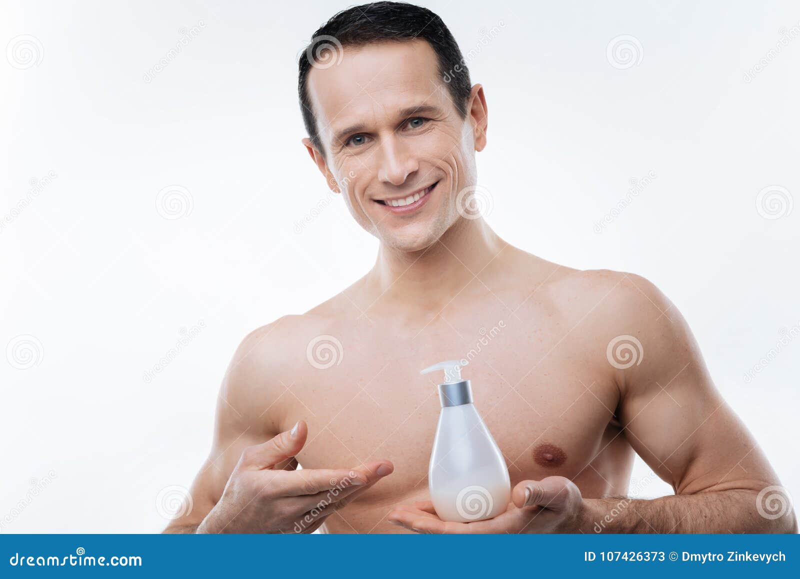 Cheerful Positive Man Holding Body Lotion Bottle Stock Image - Image of ... Cheerful Positive Man Holding Body Lotion Bottle Stock Image - Image of ...