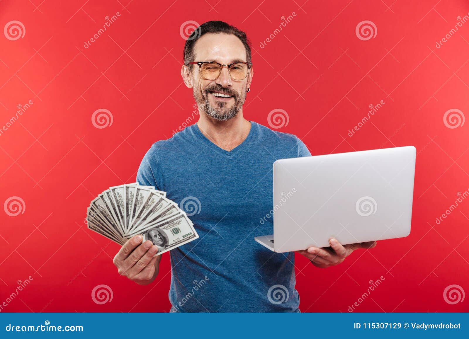 Cheerful Positive Man Using Laptop Computer Holding Money. Stock Image ... Cheerful Positive Man Using Laptop Computer Holding Money. Stock Image ...