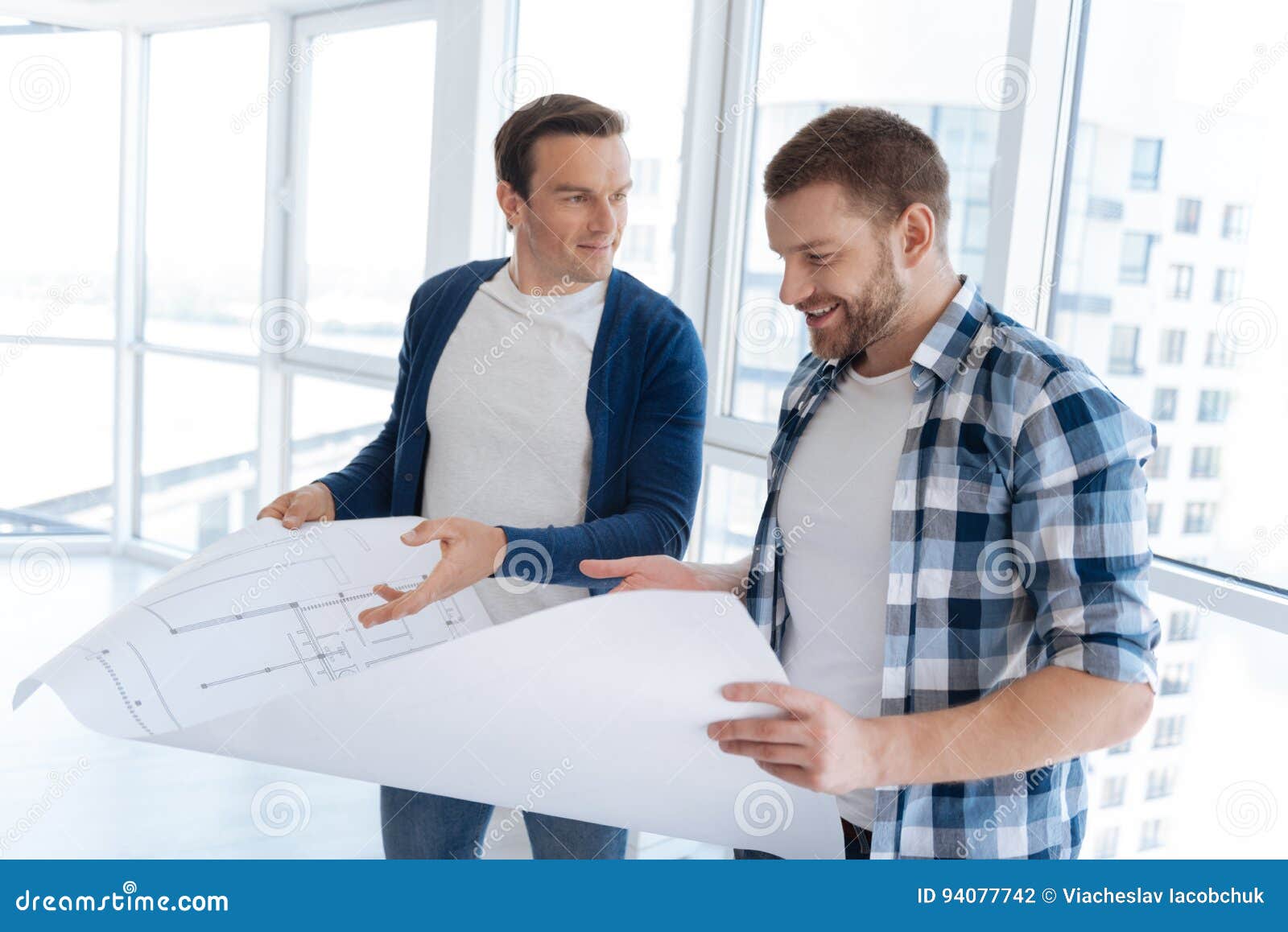 Cheerful Positive Men Discussing a Draught Stock Photo - Image of ...