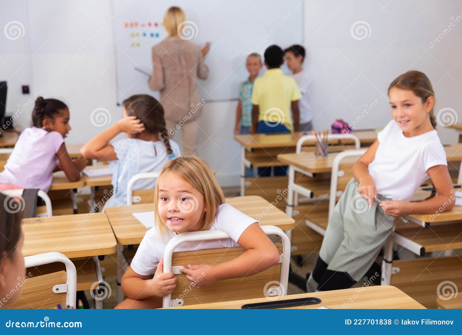 Cheerful Preteen Classmates Talking at Recess between Lessons Stock ... Cheerful Preteen Classmates Talking at Recess between Lessons Stock ...