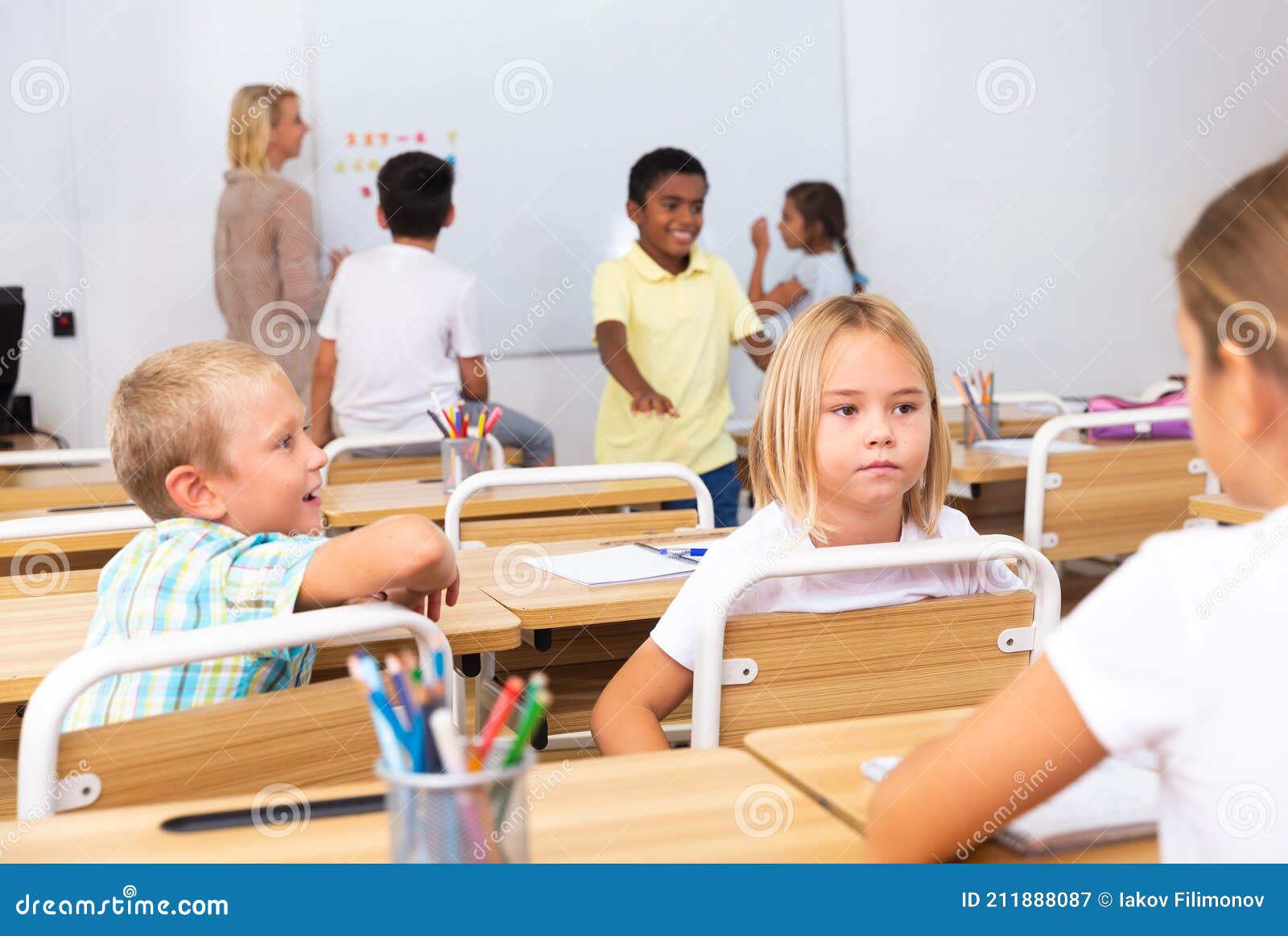 Cheerful Preteen Classmates Talking at Recess between Lessons Stock ... Cheerful Preteen Classmates Talking at Recess between Lessons Stock ...