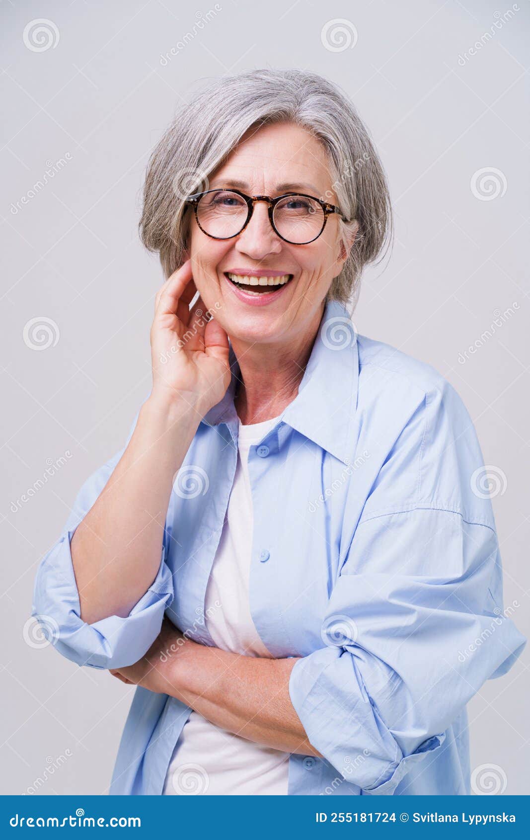 Cheerful Pretty Grey Haired Mature Business Woman In Blue Shirt And Eye